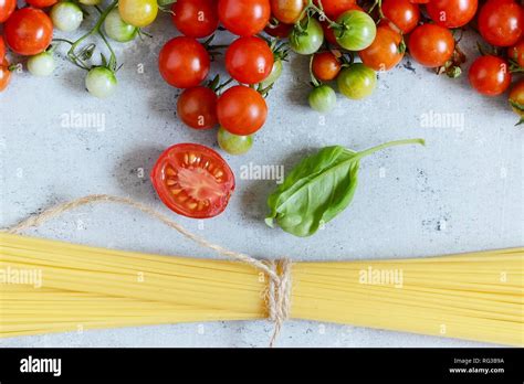 Food Frame Pasta Ingredients Concept Uncooked Spaghetti And Cherry
