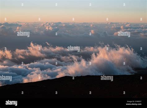 Sunset At Haleakala Lookout With Spectacular Cloud Formations As Seen