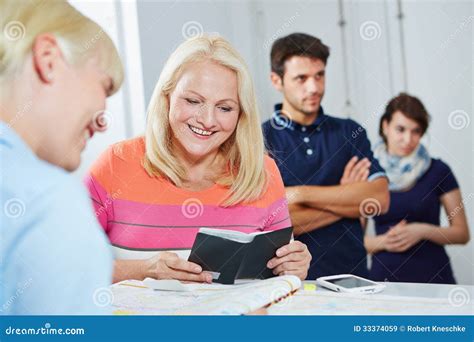 Senior Woman Making Appointment At Doctors Office Stock Image Image