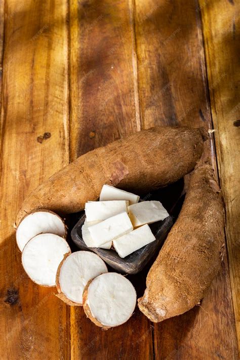 Premium Photo Pile Of Cassava Cassava And Cassava Flour On A