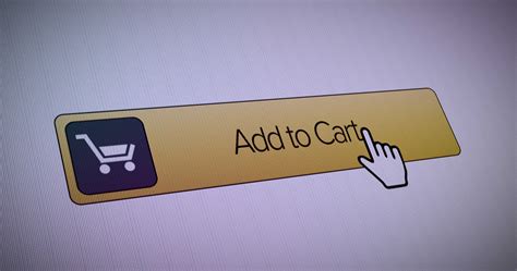 clicking on an add to cart button with a mouse pointer a close up shot
