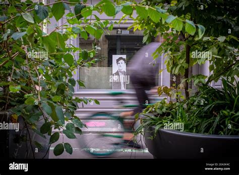 Motion Blurred Unrecognizable Man Passing In Front Of A Window In Which