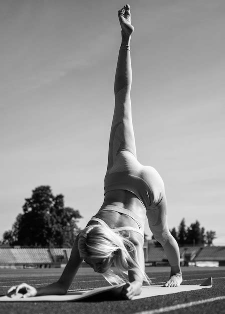Premium Photo Flexible Woman Stretching On Stadium In Sportswear Pilates