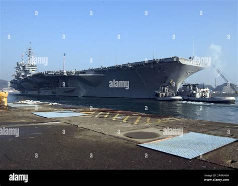 Us Navy The Conventionally Powered Aircraft Carrier Uss Kitty Hawk Cv 63 Is Pushed Away From