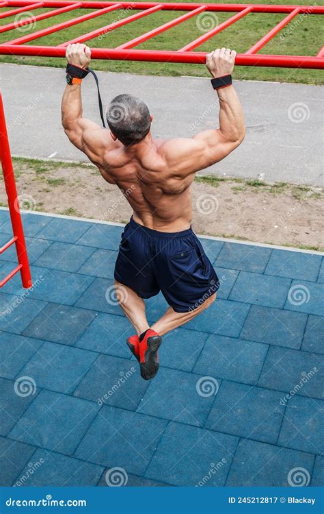 Muscular Man Doing Pull Ups On Horizontal Bar Stock Image Image Of