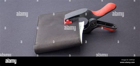 Image Of A Workshop Clamp That Keeps A Wallet Locked And Closed Where
