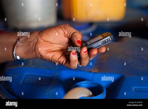 A Woman Using Her Mobile Phone Nigeria Africa Stock Photo Alamy