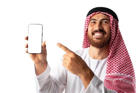 Premium Photo Young Arab Muslim Man In Traditional Clothes Showing