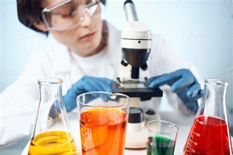 Female Laboratory Assistant Chemical Solution Microscope Research