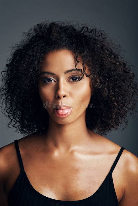 African Woman Tongue And Beauty In Studio For Hair Care Natural