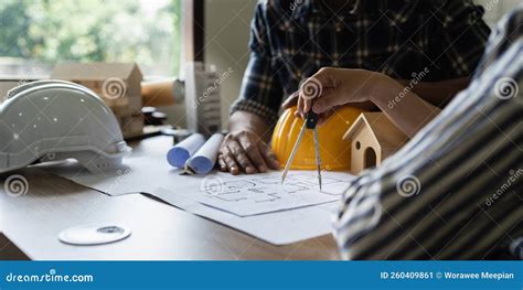 Architect Team Working With Blueprints For Architectural Plan Engineer Sketching A Construction