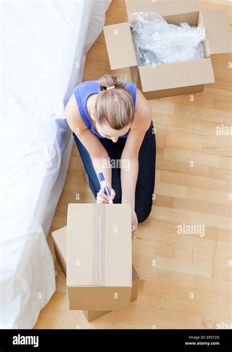 Beautiful Woman Writing On A Box Stock Photo Alamy