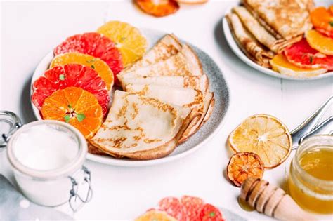 Premium Photo Pancakes With Citrus On A Plate
