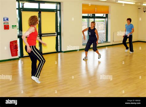 Females Doing Step Exercises In A Workout Class Stock Photo Alamy