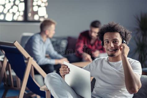 Laughing African American Hipster Software Developer At Computer At