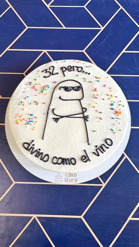 A Birthday Cake With Sprinkles On It Sitting On A Blue Tile Floor