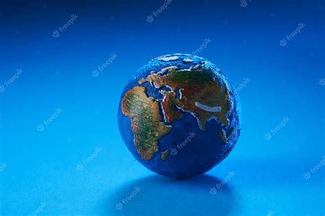 Premium Photo Mini Globe Showing Asia On Blue Background
