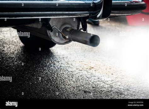 combustion fumes coming out of car exhaust pipe, exhaust gas from a car ...