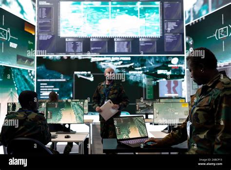 Female Trooper Working With Federal Reconnaissance Satellite System In