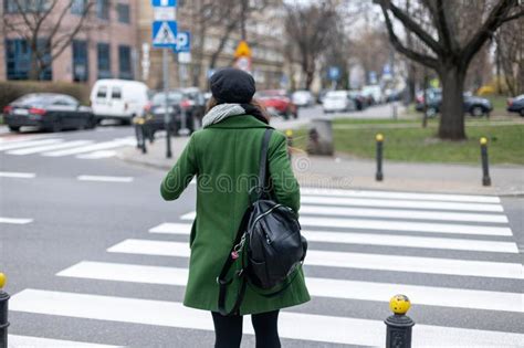 Girl In Green Dress And Cap Crossing The Road Stock Image Image Of Coat Jacket 356137707