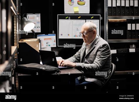 Overworked Senior Businessman Imputing Administrative Analytical Data