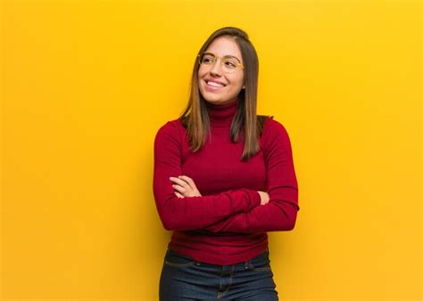 Premium Photo Young Intellectual Woman Smiling Confident And Crossing