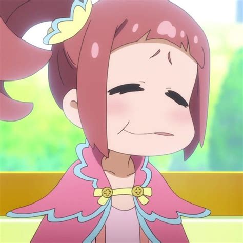 An Anime Character With Pink Hair And Blue Eyes Wearing A Pink Outfit Looking At The Camera