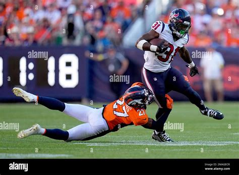 Houston Texans Running Back Dameon Pierce 31 Is Tripped Up By Denver