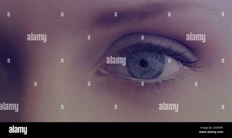A Close Up Shows Young Caucasian Female With Blue Eyes And Makeup Stock