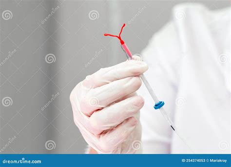 Gynecologist Holding An Iud Birth Control Device Stock Image Image Of Doctor Health