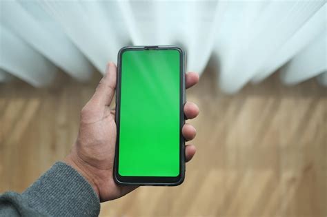 Premium Photo Pov Shot Of Young Man Hand Holding Smart Phone At Home