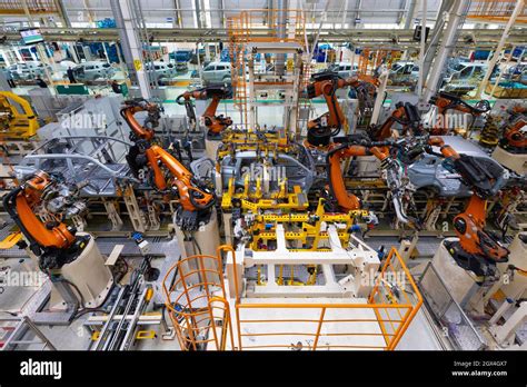 Assembly Line In A Car Factory Welding With Robots Automated Work