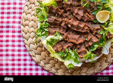 Turkish Food Cig Kofte With Lemon Lettuce And Parsley On Silver Tray