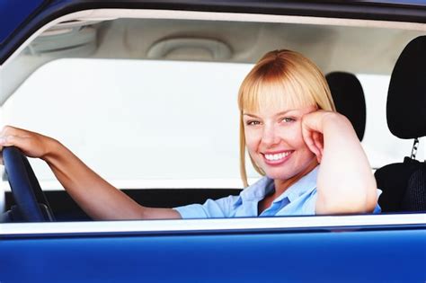 Premium Photo Pretty Woman Smiling From The Drivers Seat Of A Car