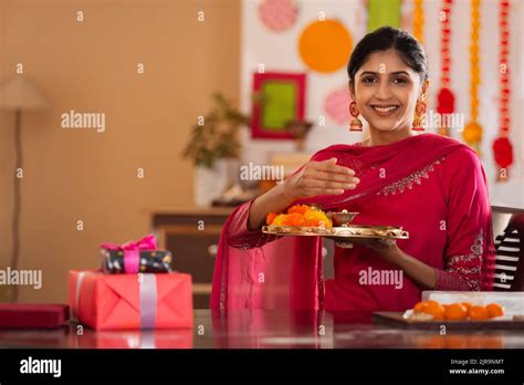 Sister Holding Pooja Plate On The Occasion Of Raksha Bandhan Stock