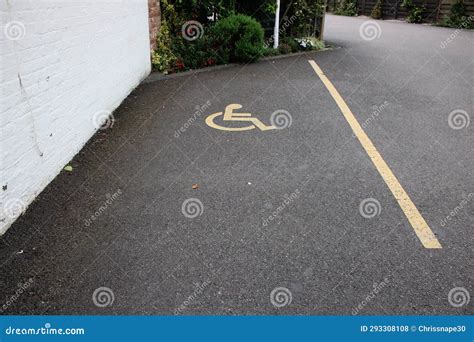 Disabled Parking Bay Yellow Disabled Symbol With Painted Line UK Stock