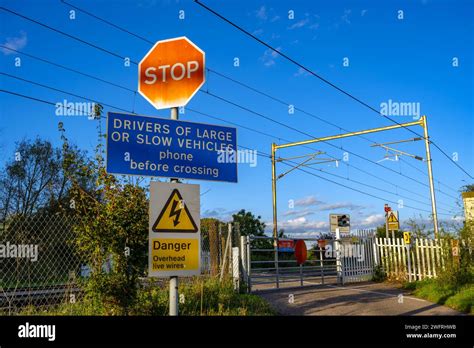 Stop Light At Level Crossing Of The Main Line To East Anglia Near