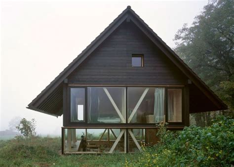 Swiss House By Pascal Flammer With Wooden Braces And A Circular Window