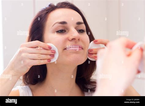 Applying Makeup In Bathroom Mirror Hi Res Stock Photography And Images