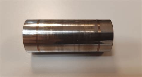 Piston Pin After A Fired Engine Test Showing Typical Wear Marks From