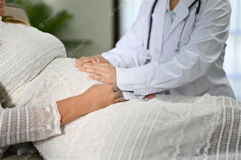 Premium Photo Female Doctor Or Obstetrician Checking Up Her Patient