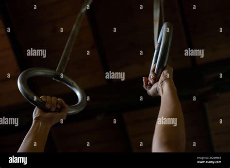 Latin American Woman Hands Holding Gymnastic Rings During Her Workout