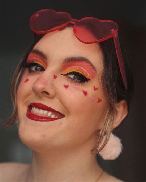 Red Heart Shapes Painted On Nose And Face With Red Heart Shaped