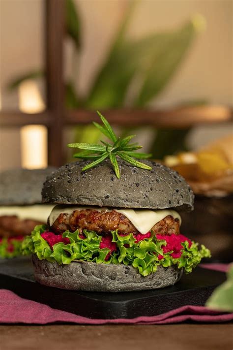 Burger With Black Bun Made With Charcoal Consisting Of Filling A