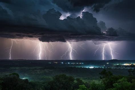 Premium Photo Lightning Storm In The Sky Over A Field Of Grass And Trees