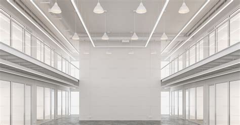 빈 로프트 스타일의 상업 공간 인테리어 3d는 흰색과 광택이 나는 콘크리트 바닥으로 렌더링됩니다 사진 Unsplash의 사무실 이미지