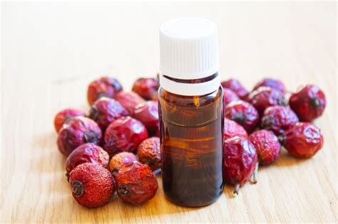 Premium Photo Rosehip Seed Essential Oil In A Small Bottle Selective