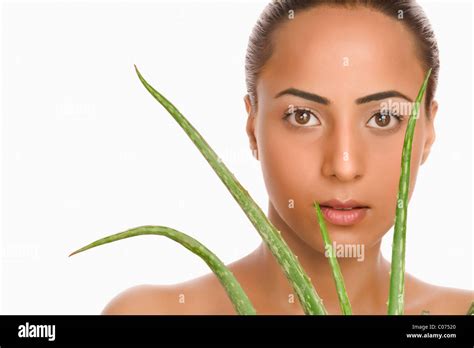 Portrait Of A Woman Holding An Aloe Vera Plant Stock Photo Alamy