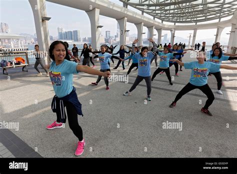 Southeast Asian Women Dancing Zumba On Pier Filipino Housemaid Sunday