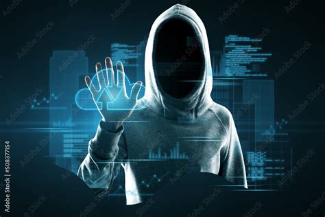 hacker in hoodie using abstract blue coding and tech information